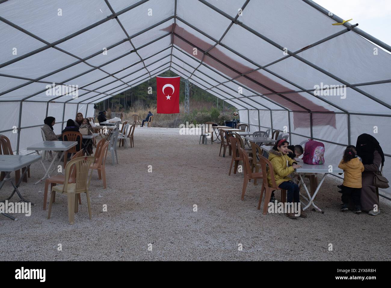 Syrian refugees are seen under a gazebo. On December 8, 2024, Islamist-led opposition forces ...