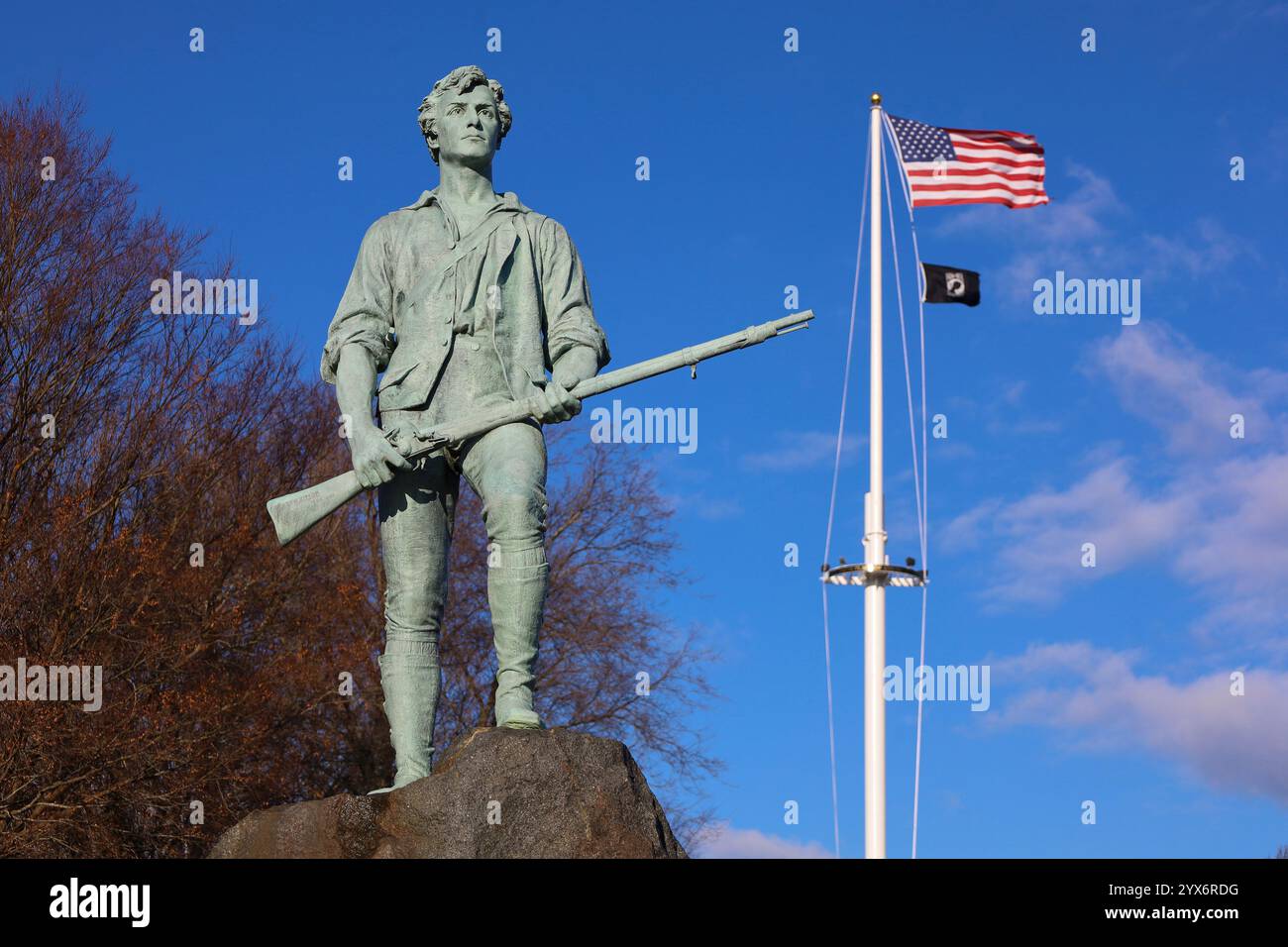Minuteman Statue Stands over the Battle Great with American Flag Flying ...