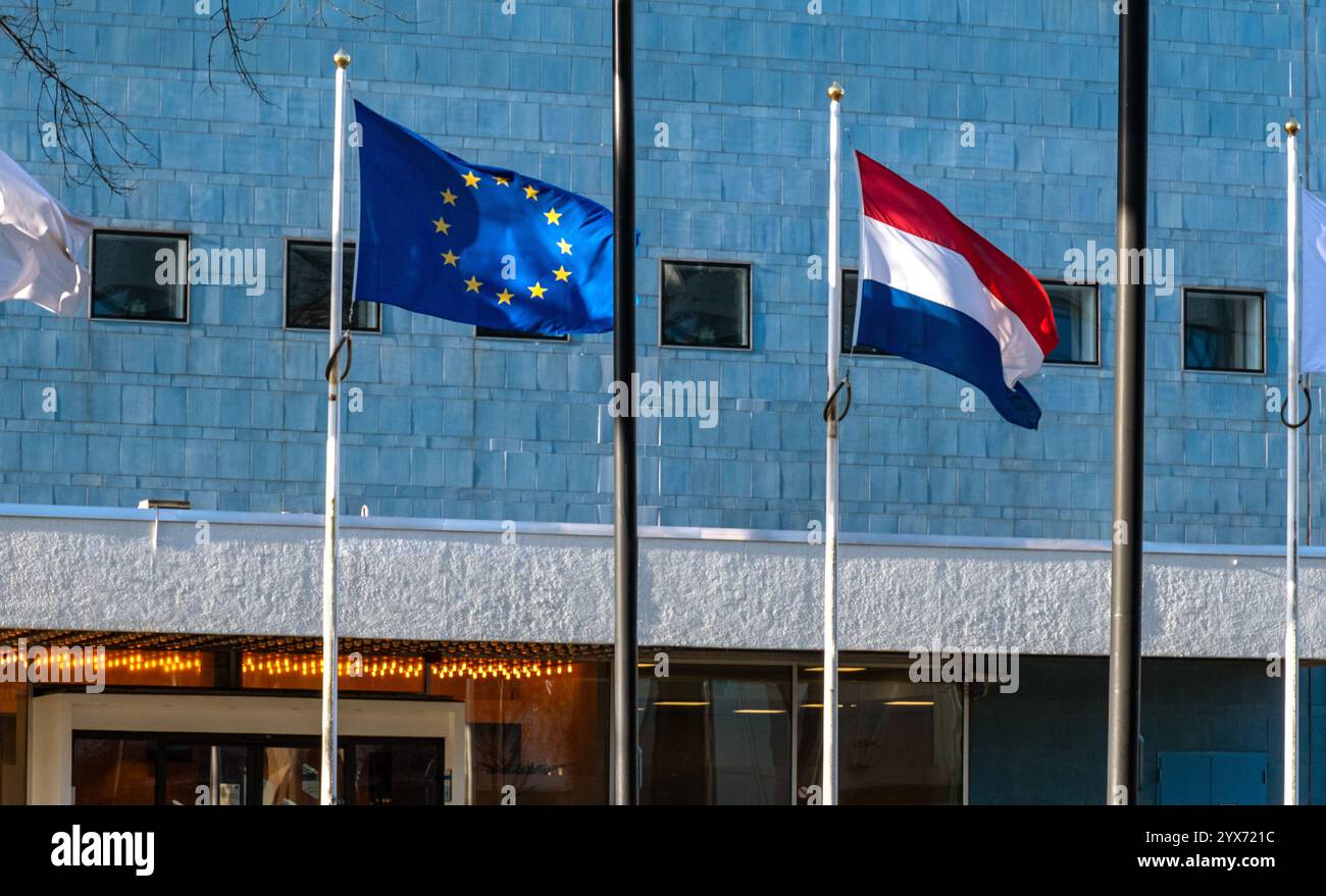 Two Flags Netherlands and European Union flutter in the wind next to ...