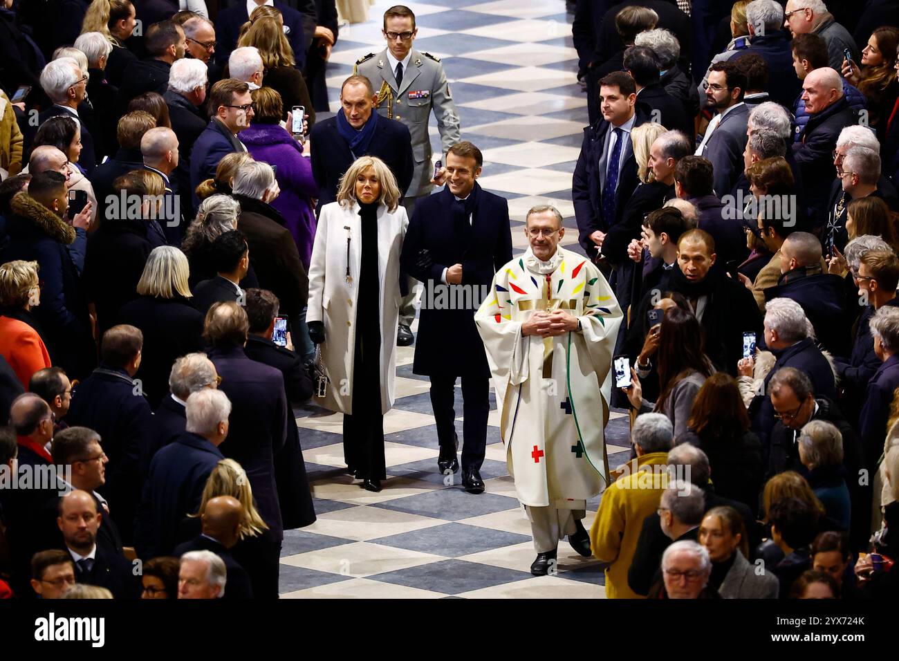 FILE - French President Emmanuel Macron, center, and his wife Brigitte ...