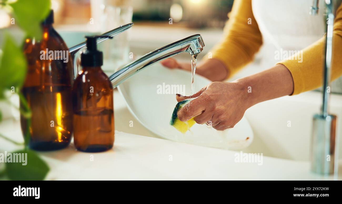 Person, hands and washing dishes in kitchen for cleaning, housekeeping ...