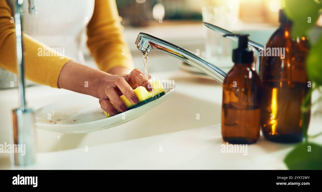 Person, hands and washing dishes in kitchen for hygiene, dirt removal ...