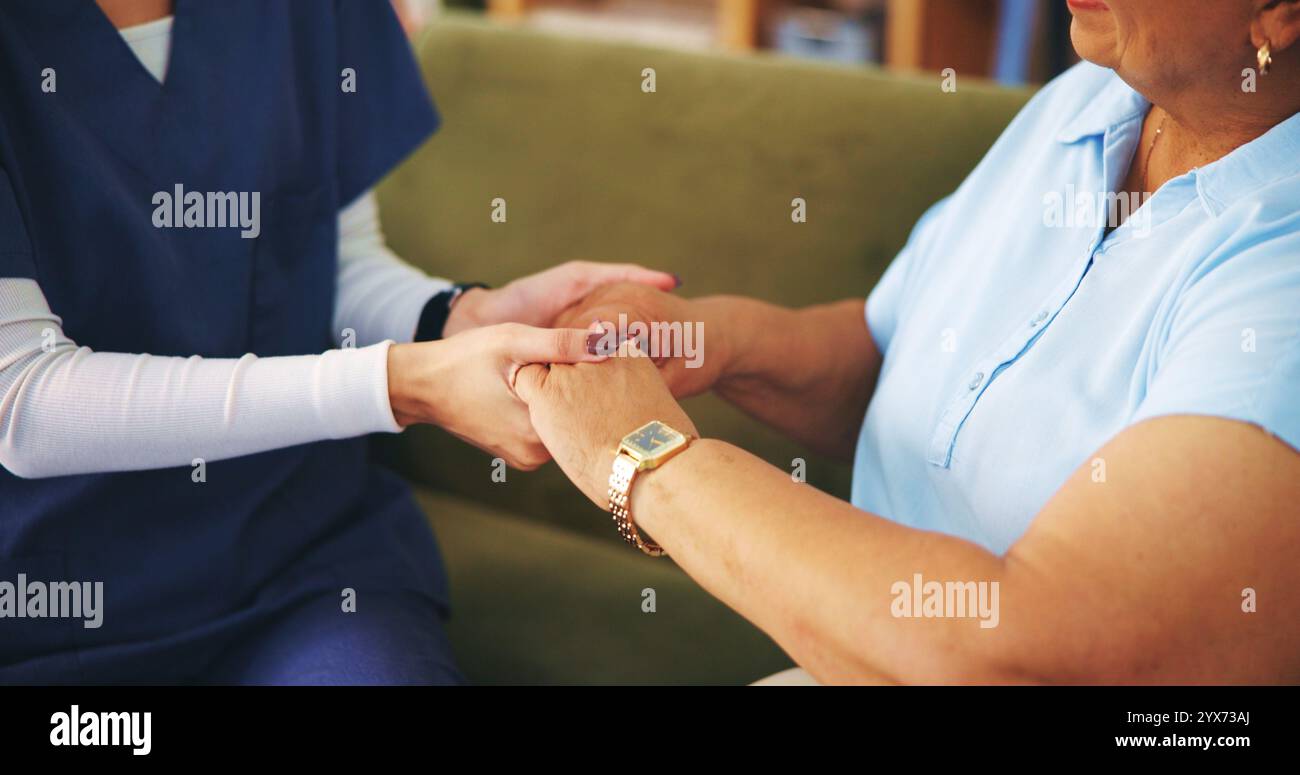 Senior woman, nurse and holding hands for empathy in home with grief, support and compassion for ...