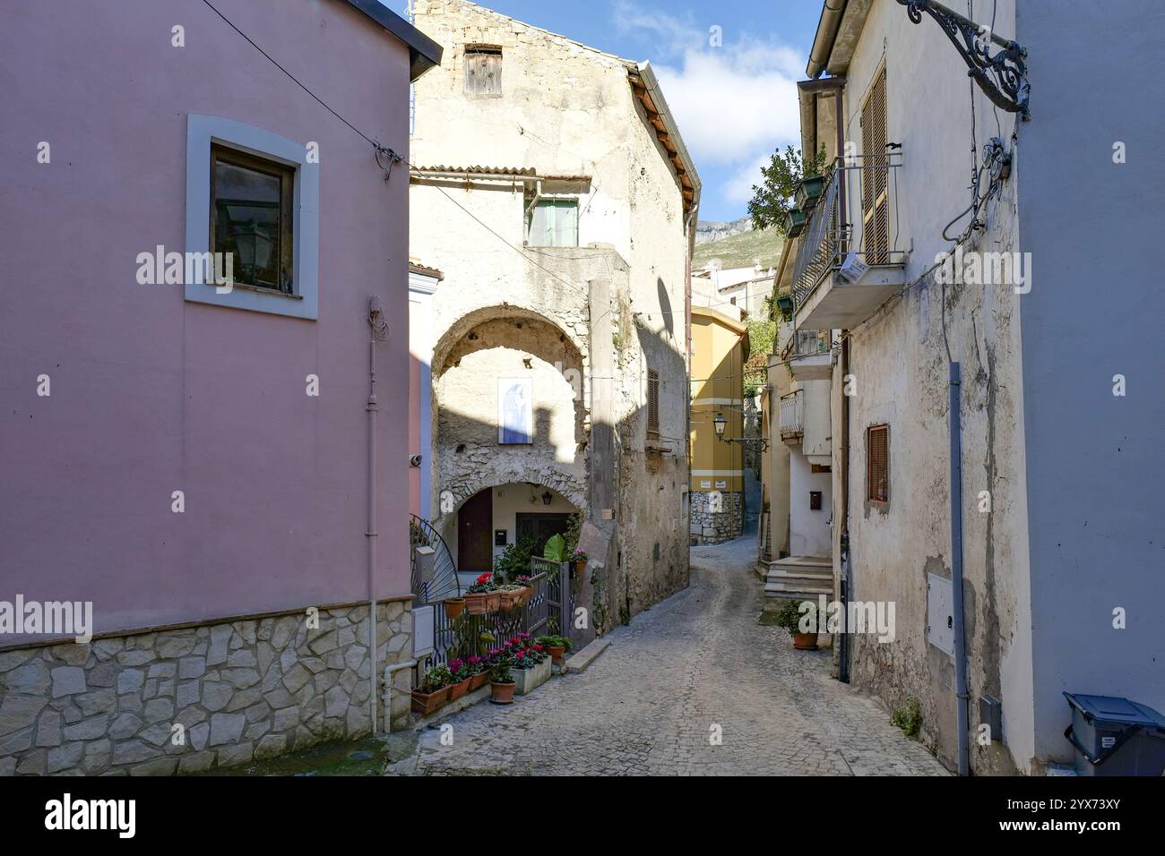 An alley among the stone houses of Maranola, a small medieval town in ...