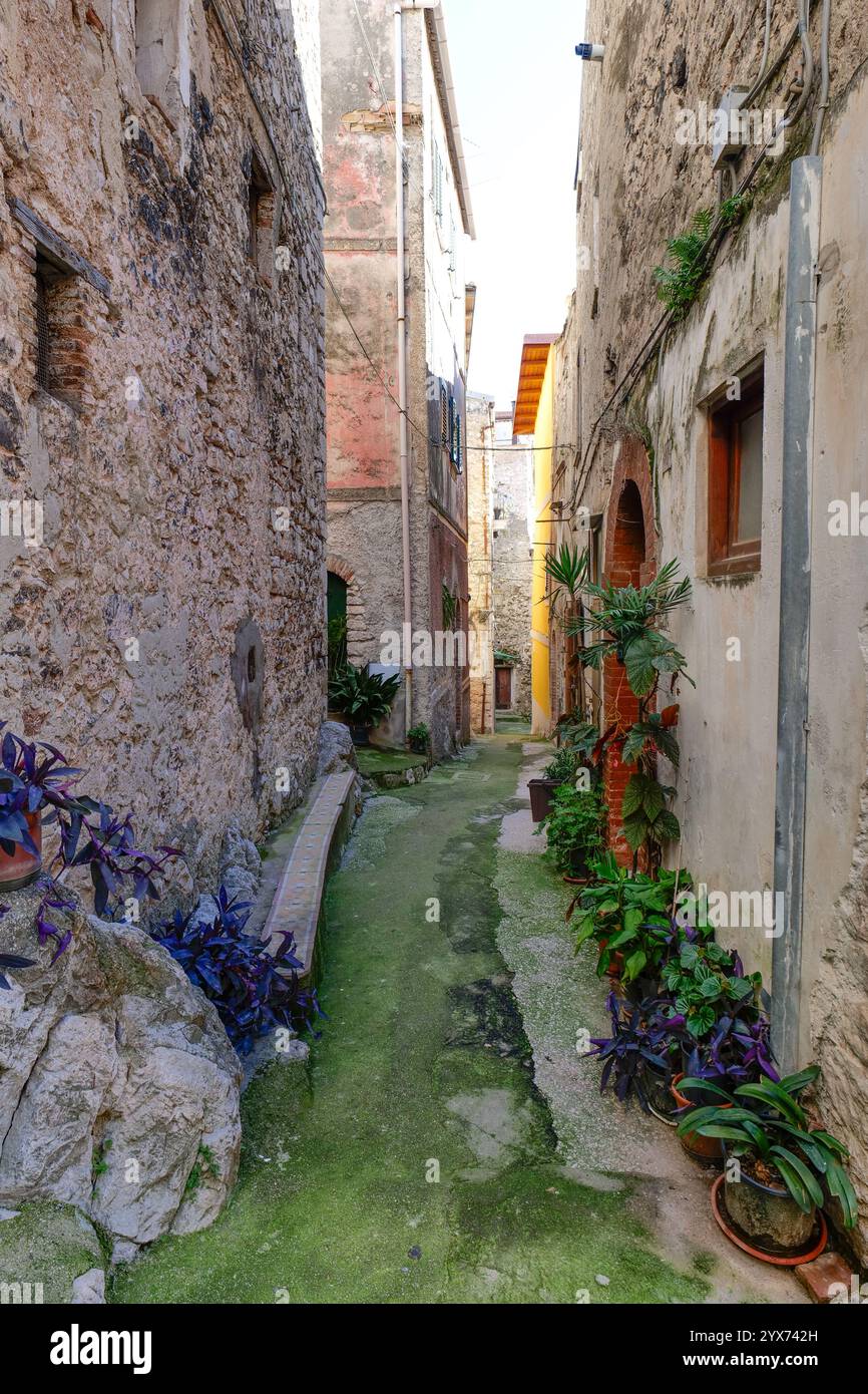 An alley among the stone houses of Maranola, a small medieval town in ...