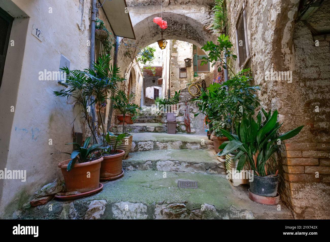 An alley among the stone houses of Maranola, a small medieval town in ...