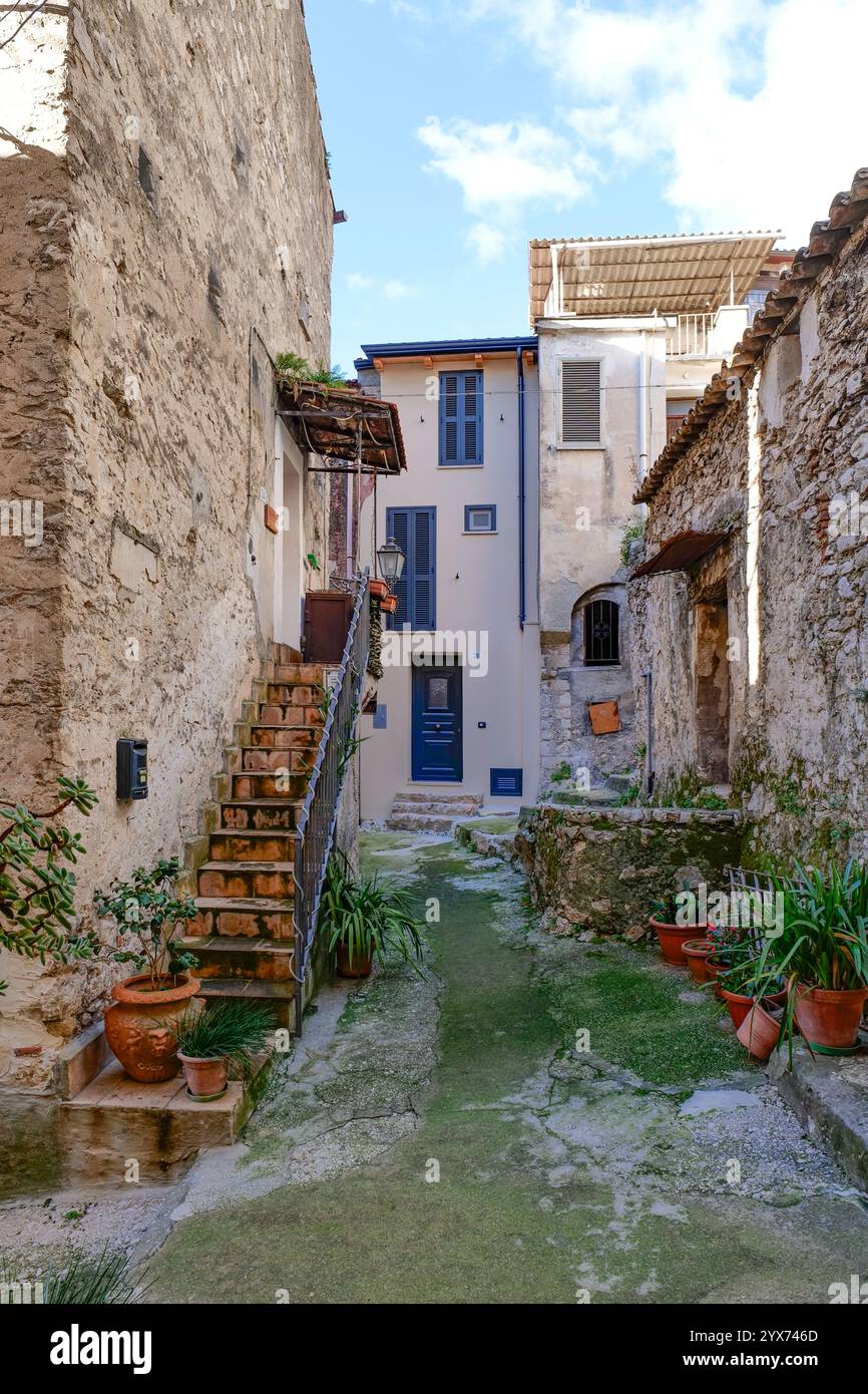 An alley among the stone houses of Maranola, a small medieval town in ...