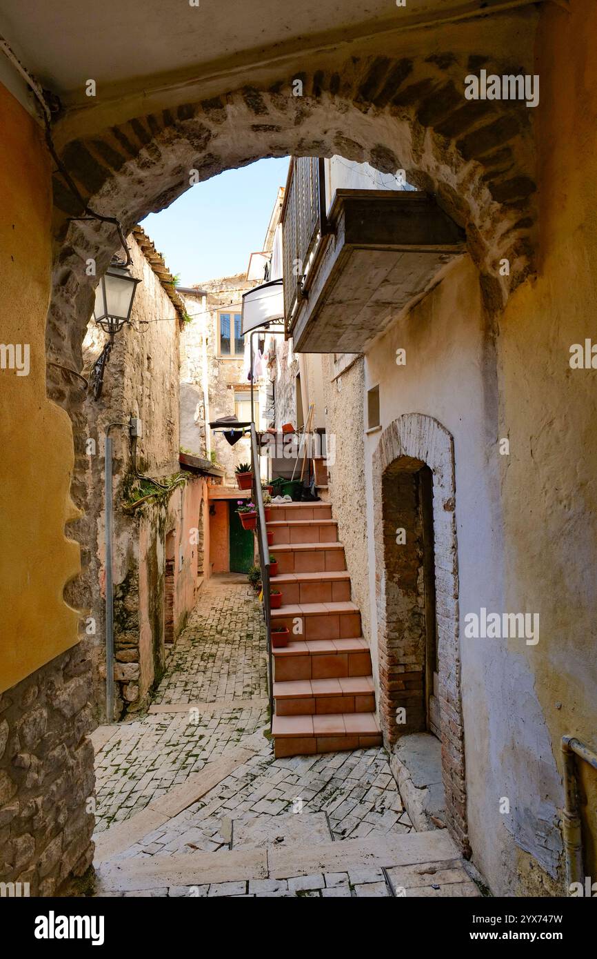 An alley among the stone houses of Maranola, a small medieval town in ...