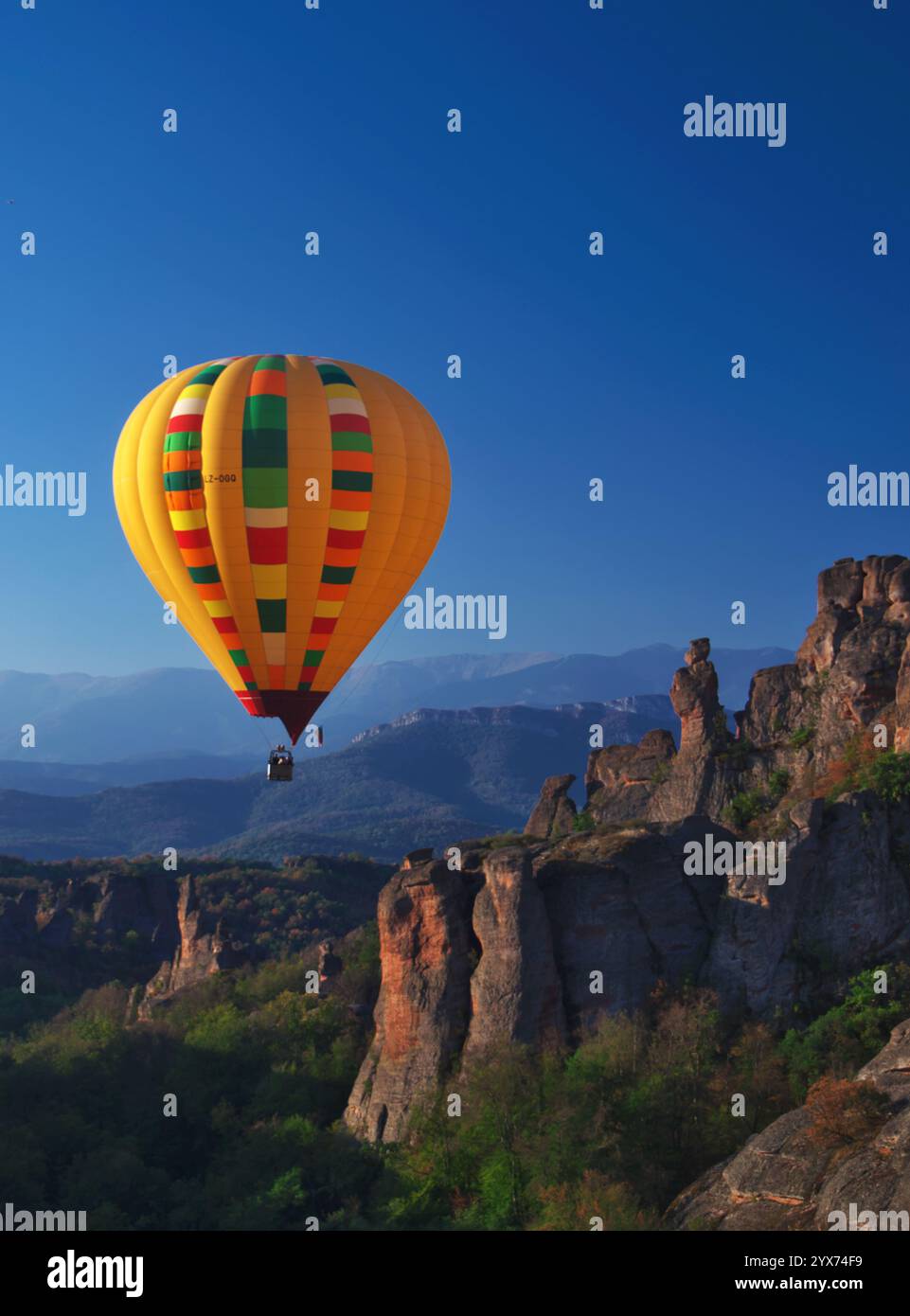 Balloon over ancient rocks Stock Photo - Alamy