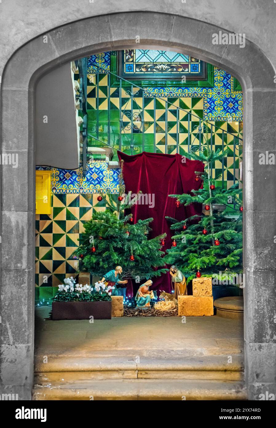 Nativity scene with figures of Mary, Joseph and baby Jesus in a rustic ...