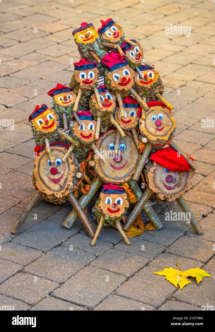 Traditional Catalan wooden Christmas figures with smiling faces and red ...