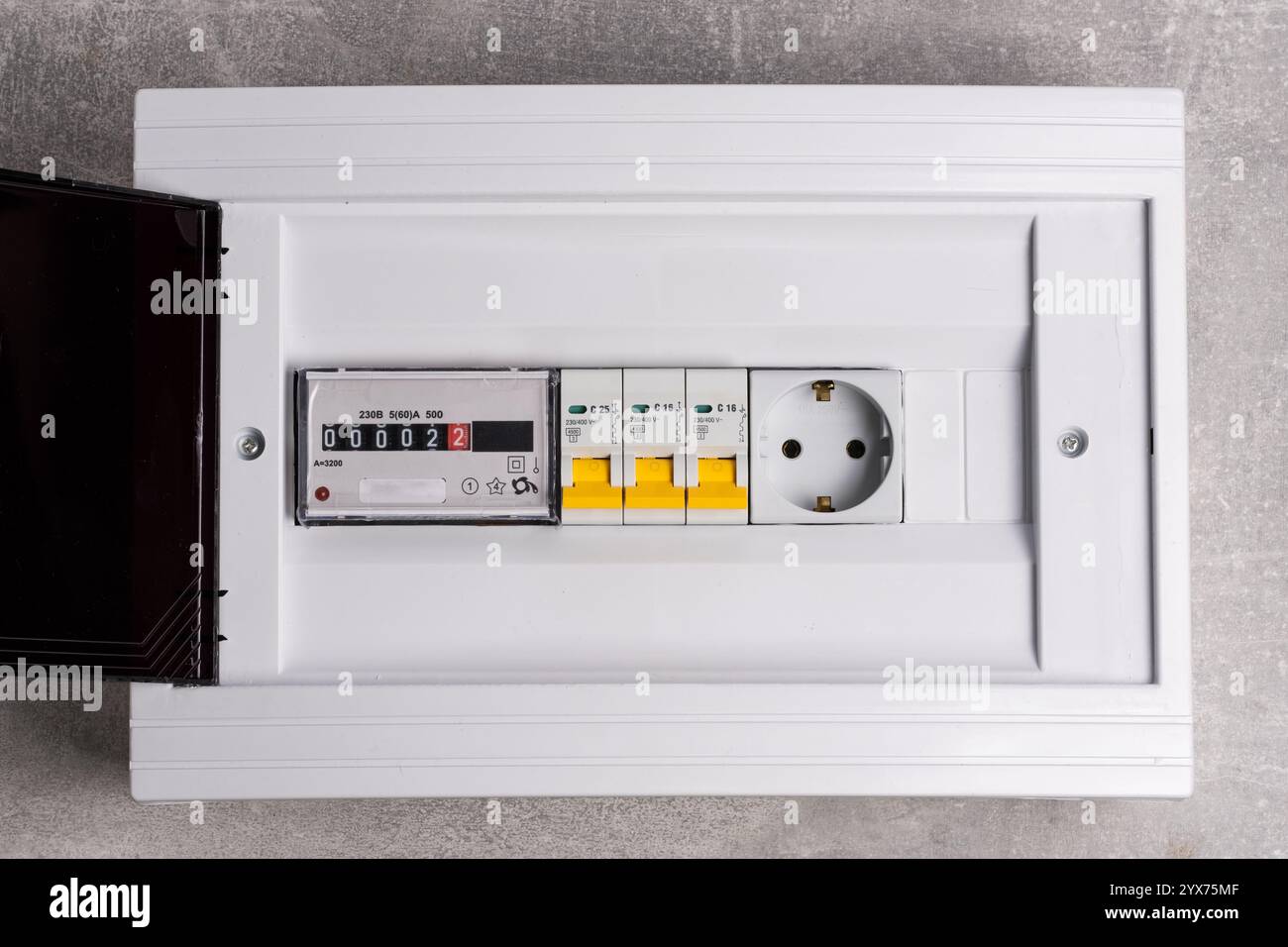 Electrical panel on gray concrete wall Stock Photo - Alamy