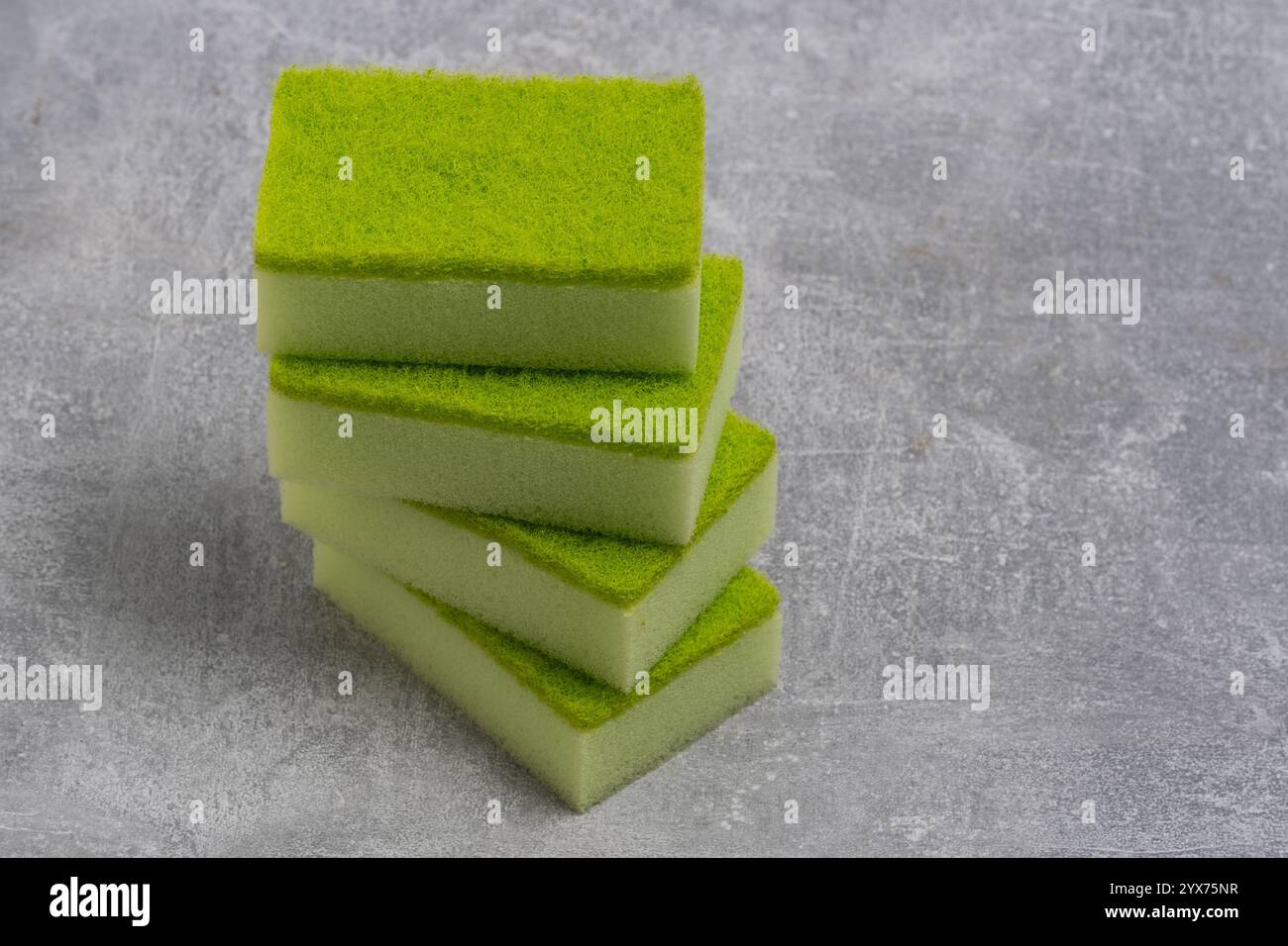 Green sponges for washing dishes on a gray stone background Stock Photo ...