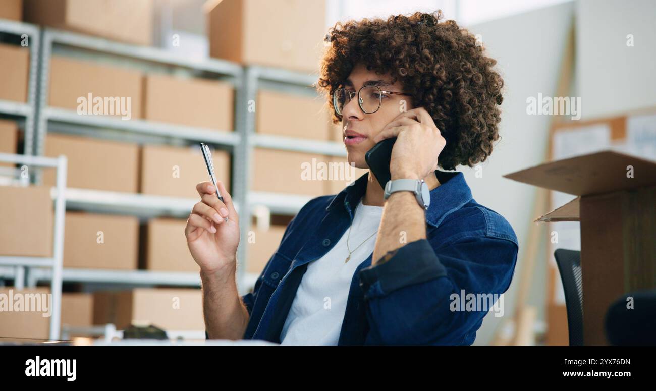 Box, logistics and phone call with business man in office for ...