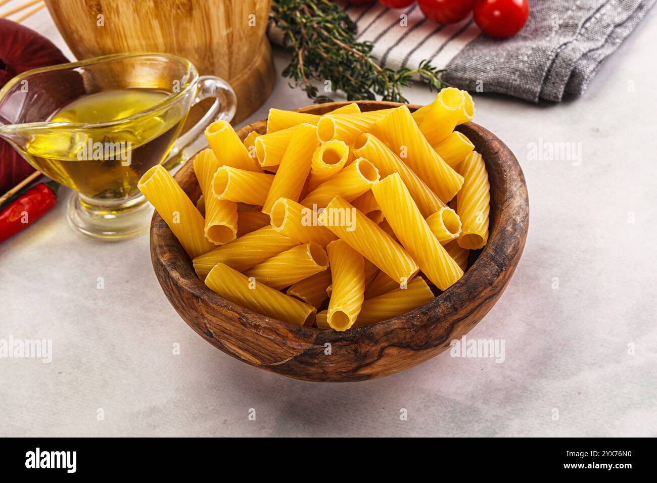Italian cuisine - raw dry tortiglioni pasta Stock Photo - Alamy