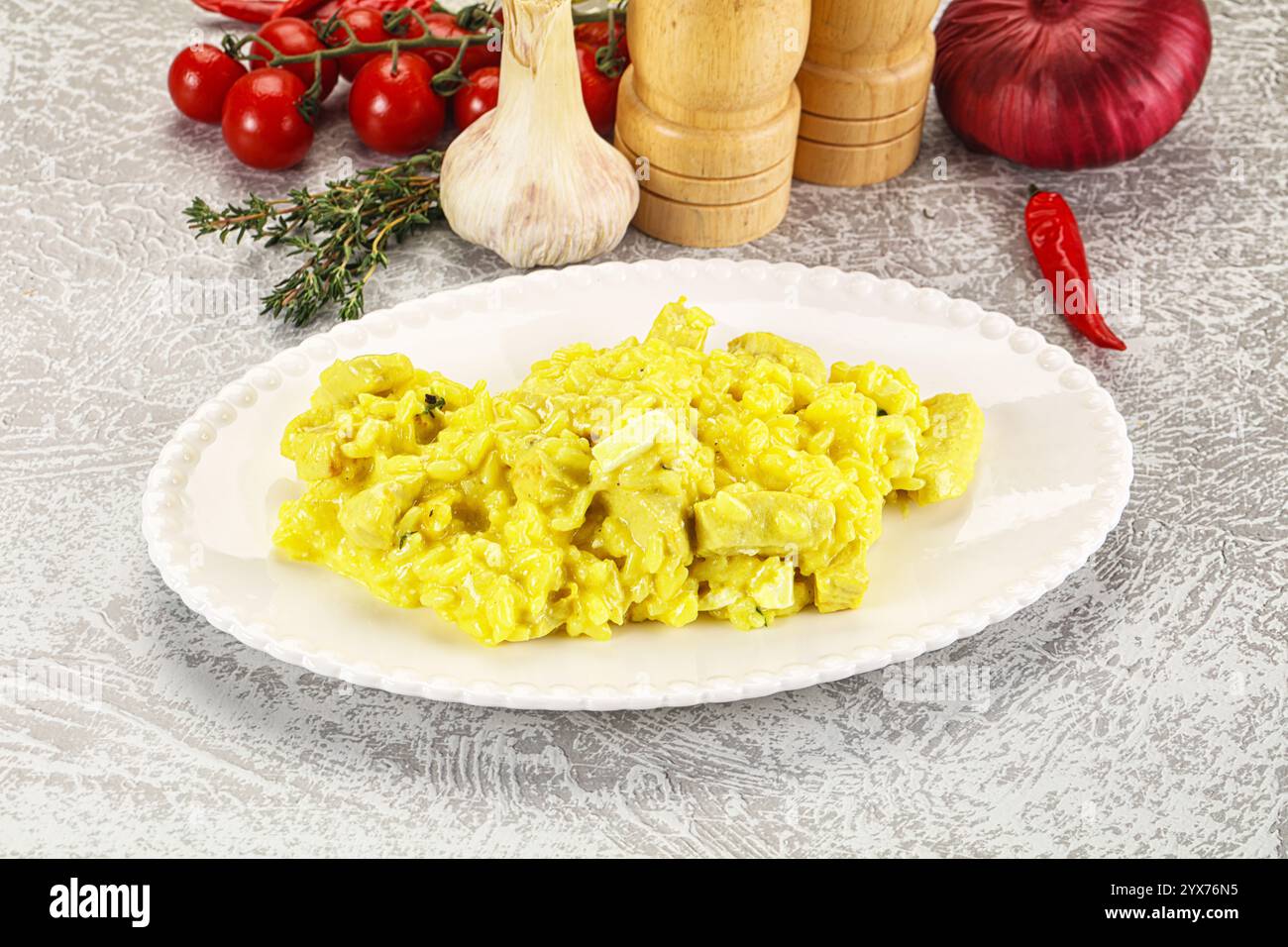 Italian cuisine - yellow risotto with chicken and soft cheese Stock ...