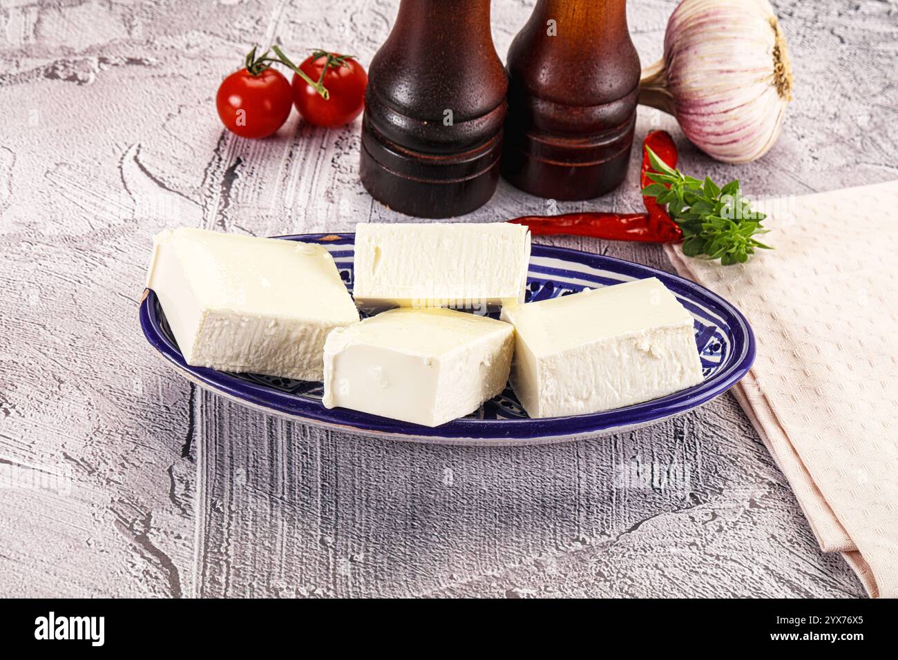 Greek traditional cuisine - Feta cheese bricks Stock Photo - Alamy