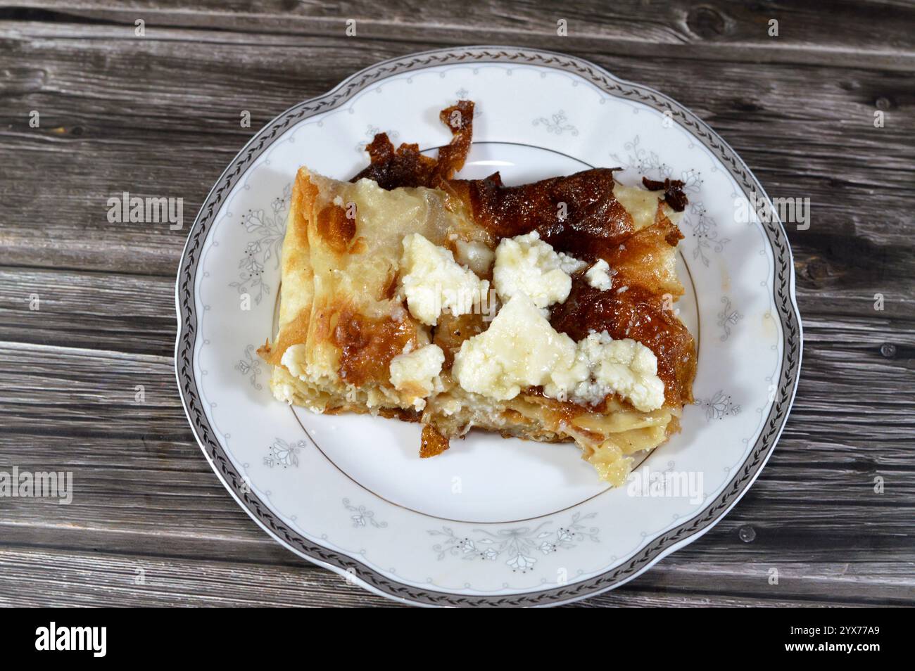 Creamy qeshta or fresh milk cream on a a cushioned pie or Feteer ...