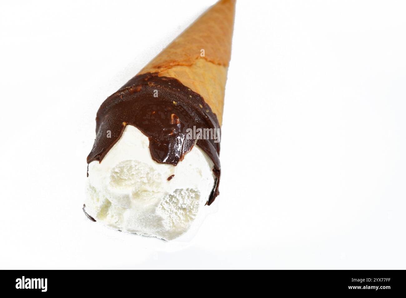 Ice cream vanilla cone coated with chocolate layer and nuts in a crispy ...