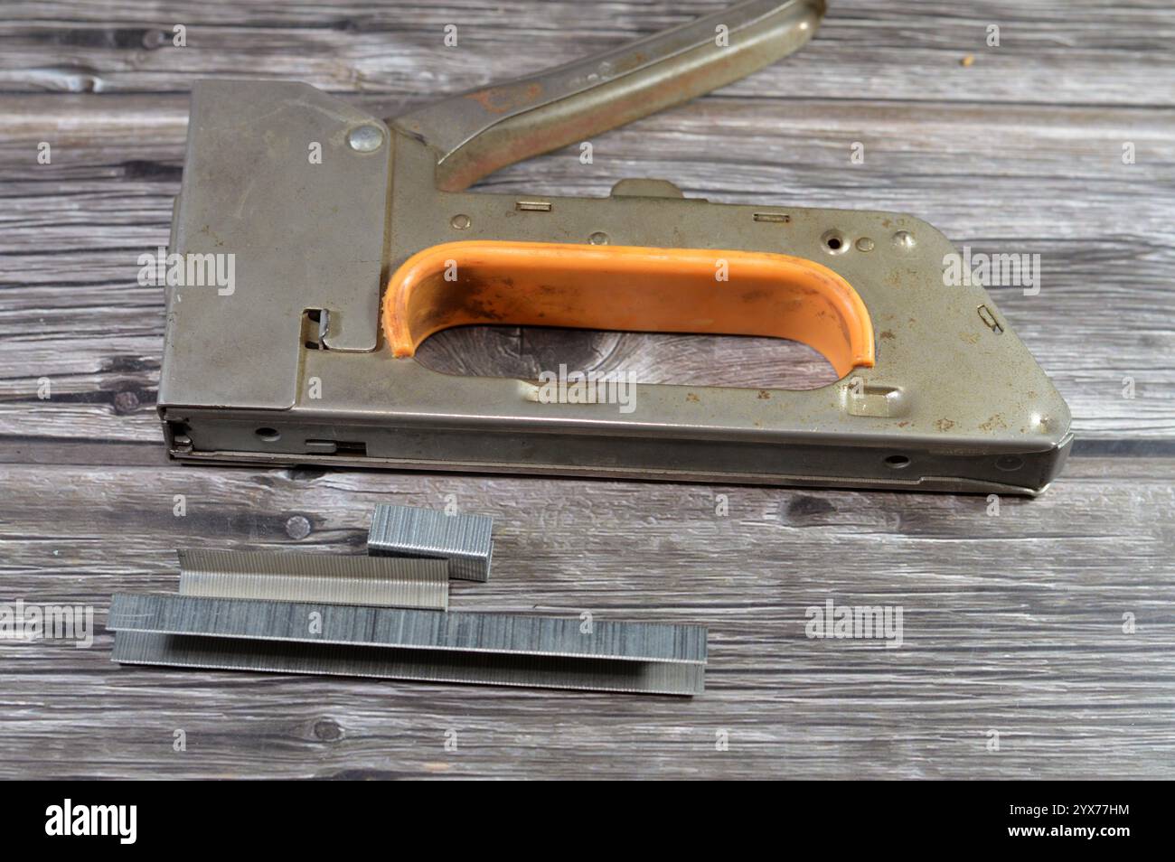 manual staple gun, powered stapler is a hand-held machine used to drive ...