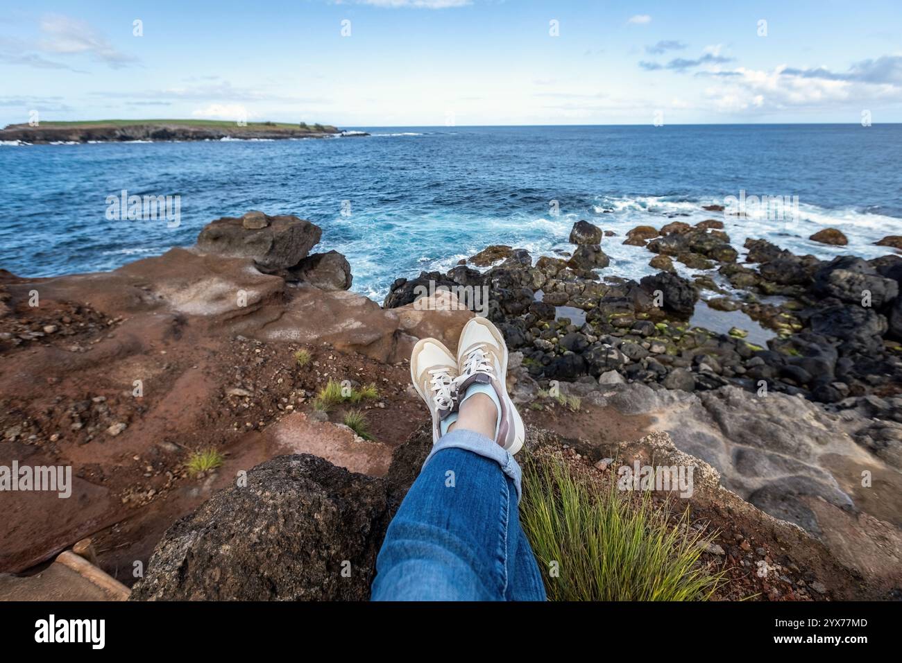 Woman's legs in front of the ocean view relaxing by the ocean Stock ...