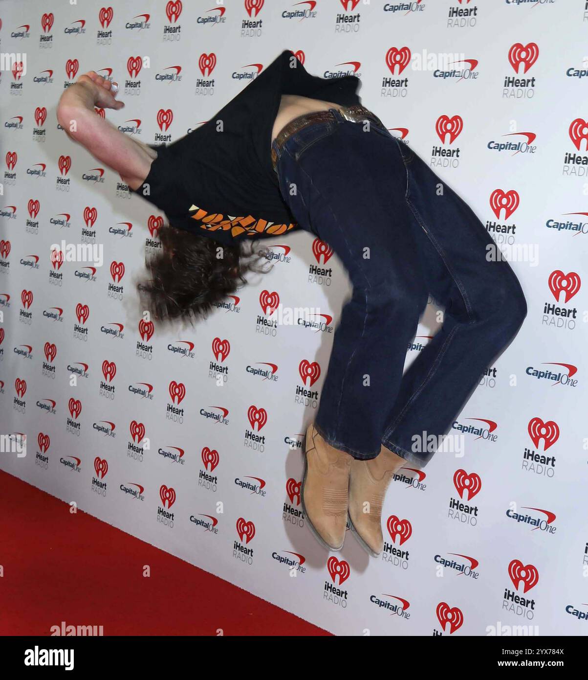 December 13, 2024, New York, New York, USA: Singer BENSON BOONE does a backflip at the red ...