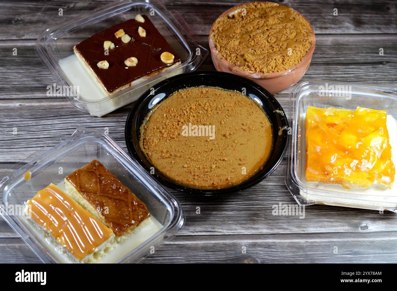 Assorted desserts of Baked Om Ali and rice pudding with milk and sugar ...