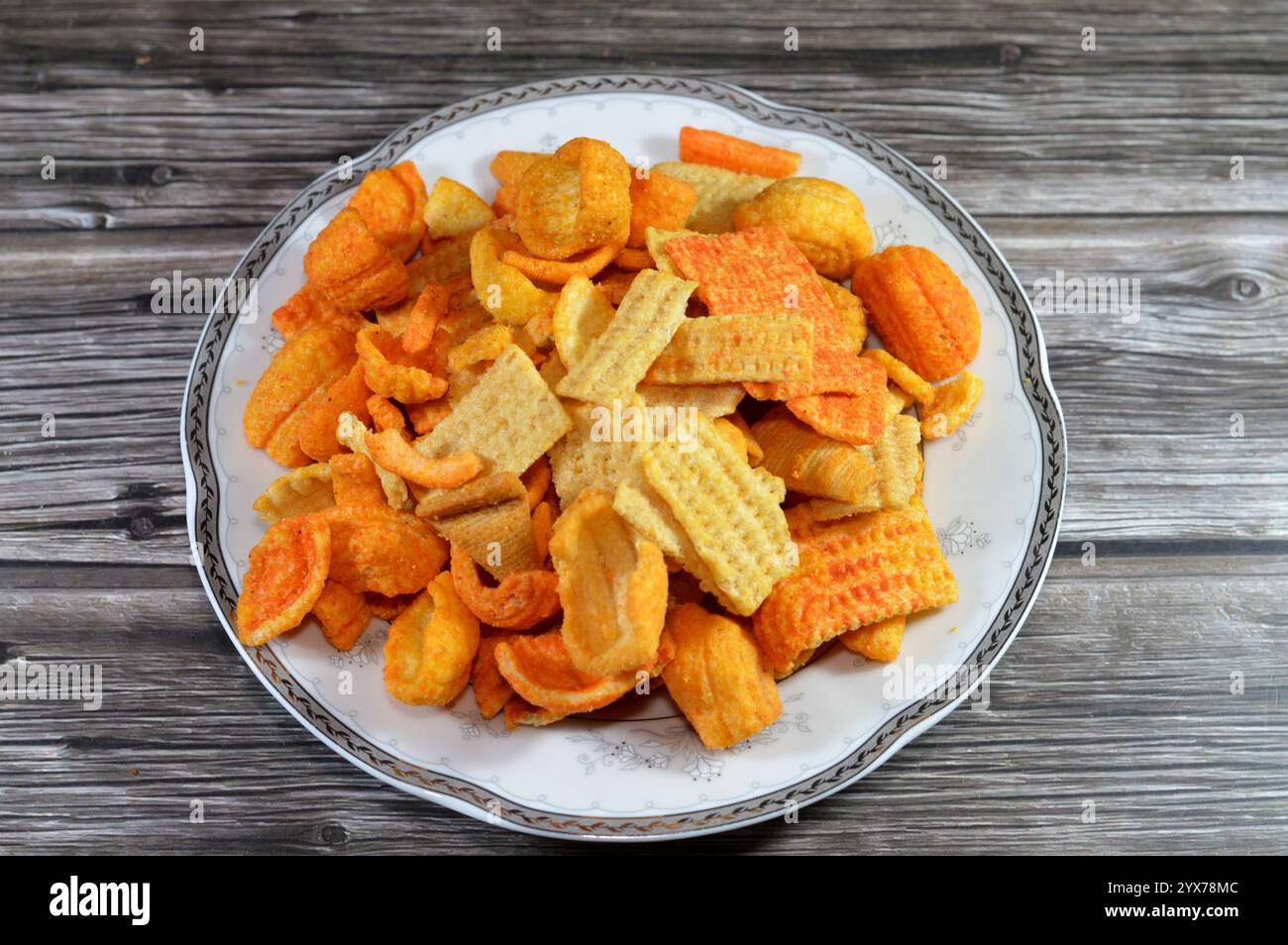 Traditional savory snacks mix, with assorted flavors of ketchup, salt ...