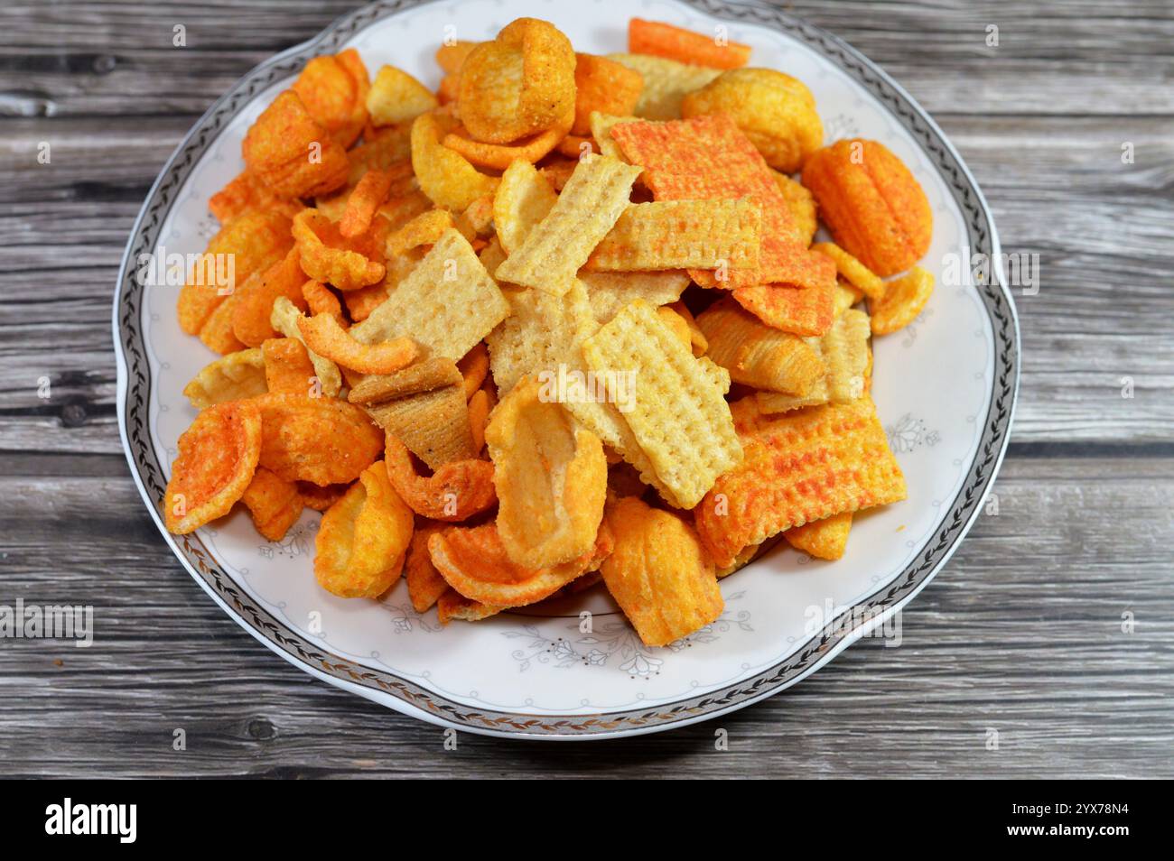 Traditional savory snacks mix, with assorted flavors of ketchup, salt ...