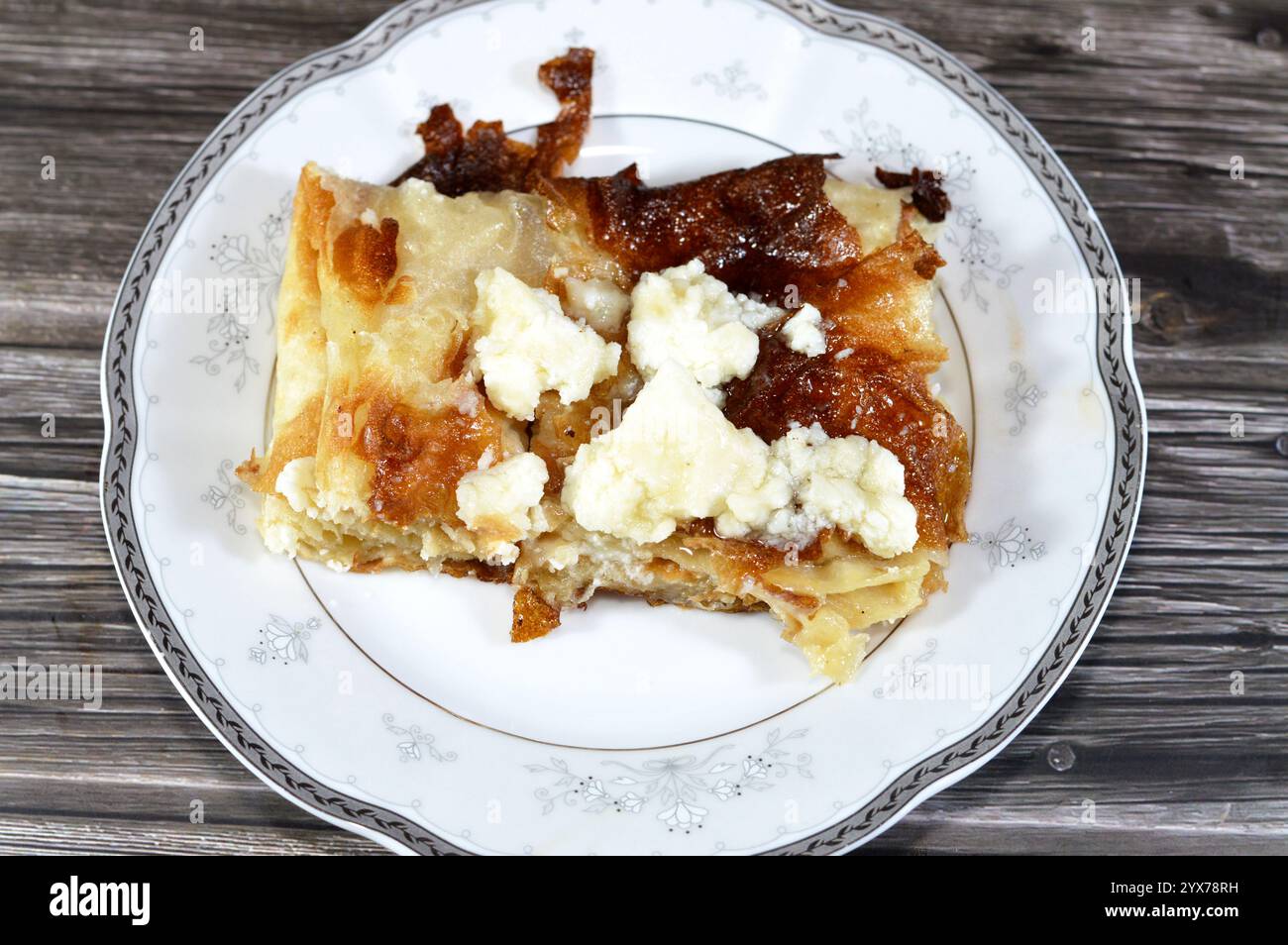 Creamy qeshta or fresh milk cream on a a cushioned pie or Feteer ...