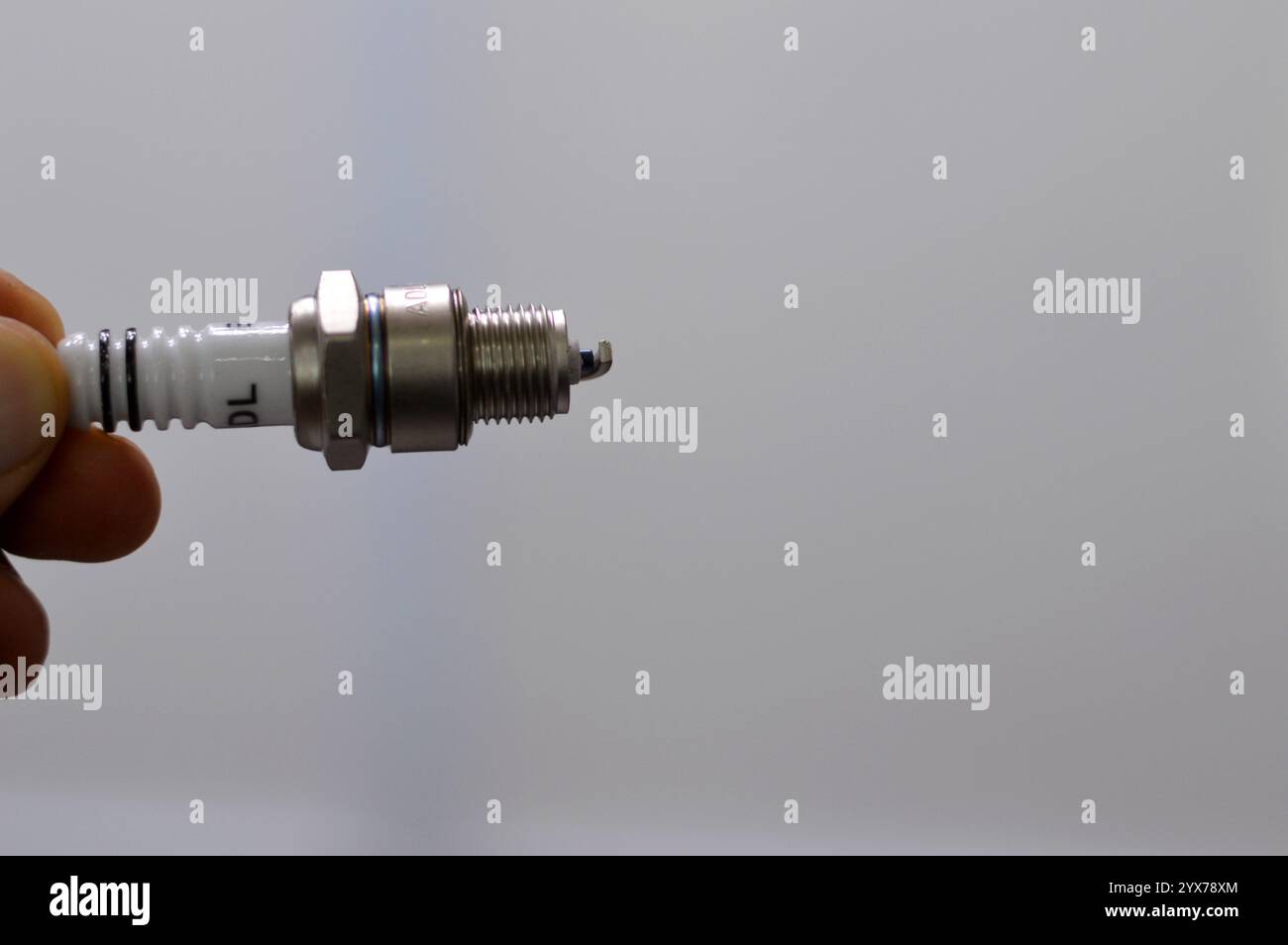 Cairo, Egypt, October 29 2024: New spark plug, a device that deliver ...