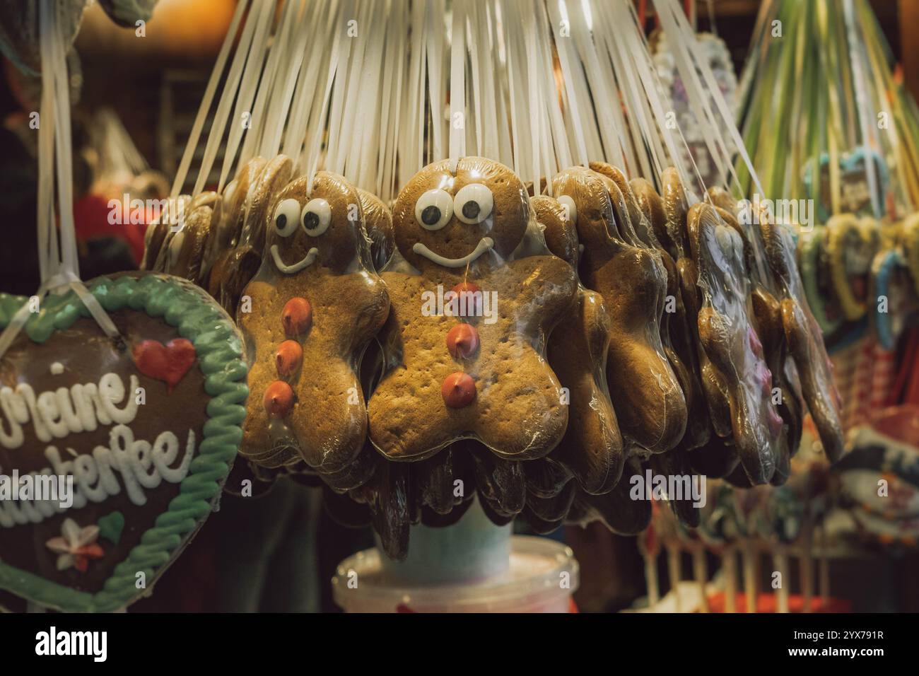 Gingerbread men hanging on christmas market Stock Photo - Alamy