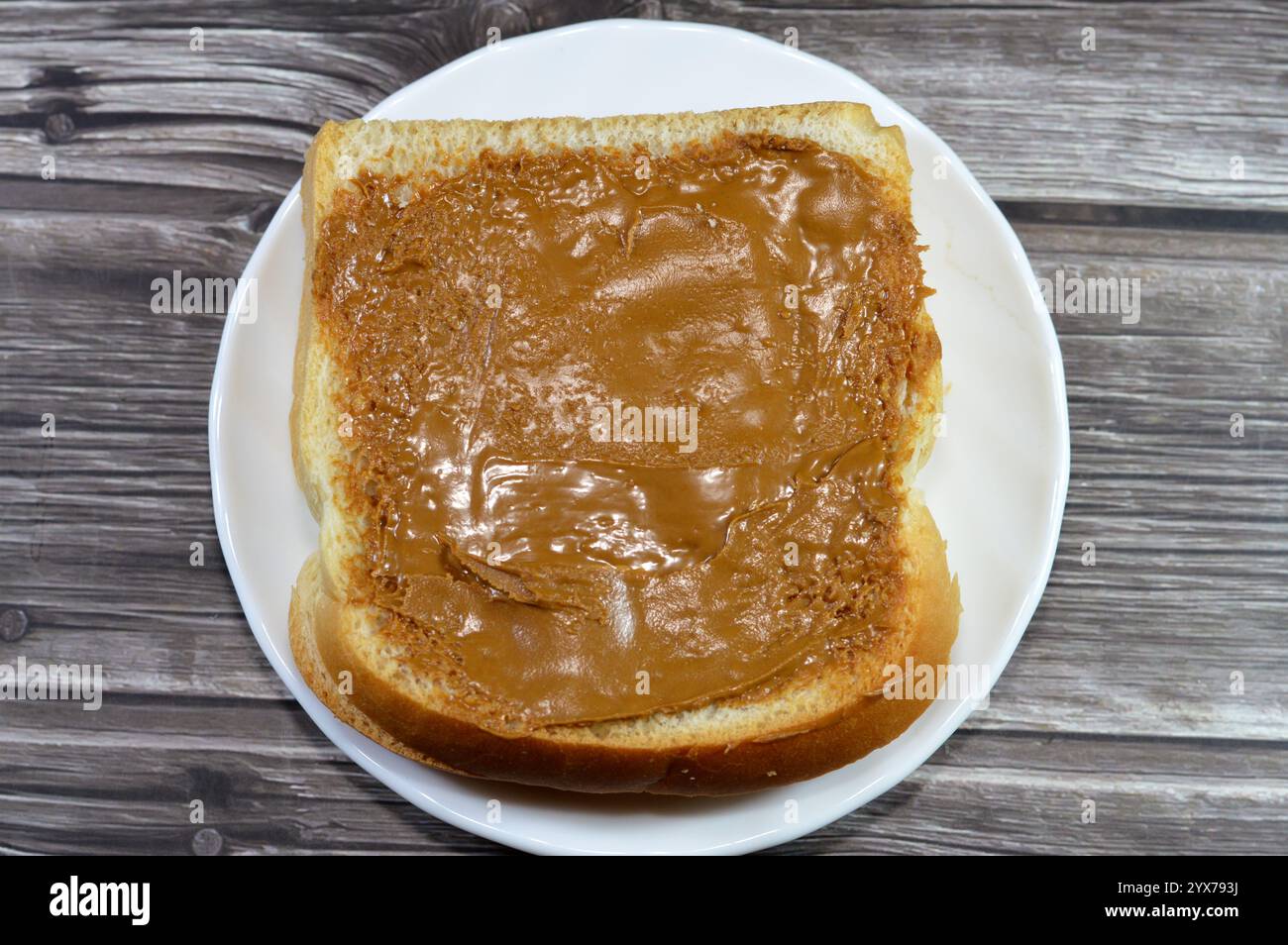 A normal toast bread with biscuits butter spread, caramelized biscuit ...