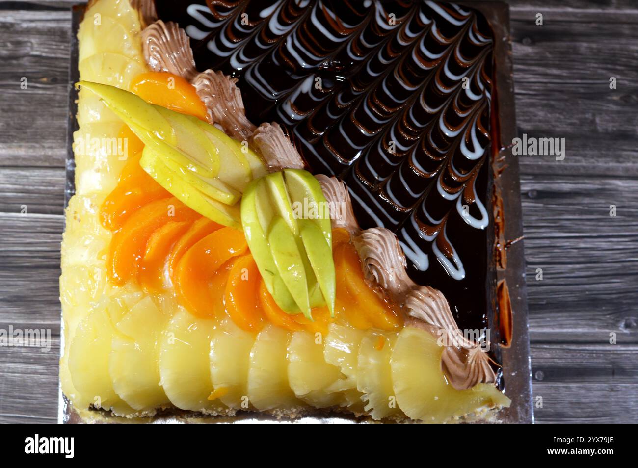 A square shape birthday cake of two halves different pieces sponge ...