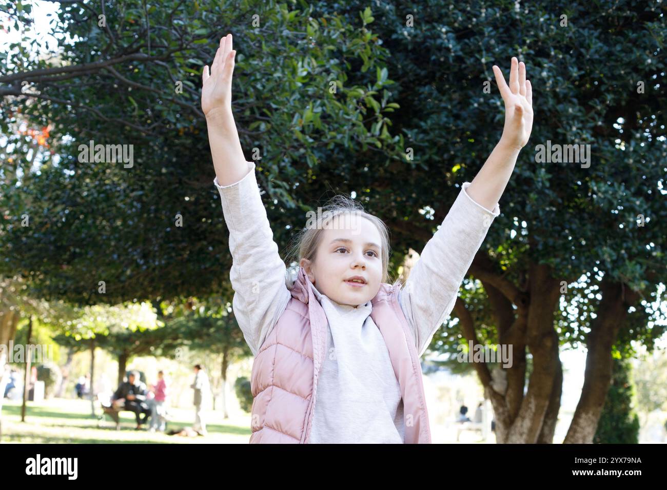 Cheerful girl standing smiling hi-res stock photography and images - Alamy