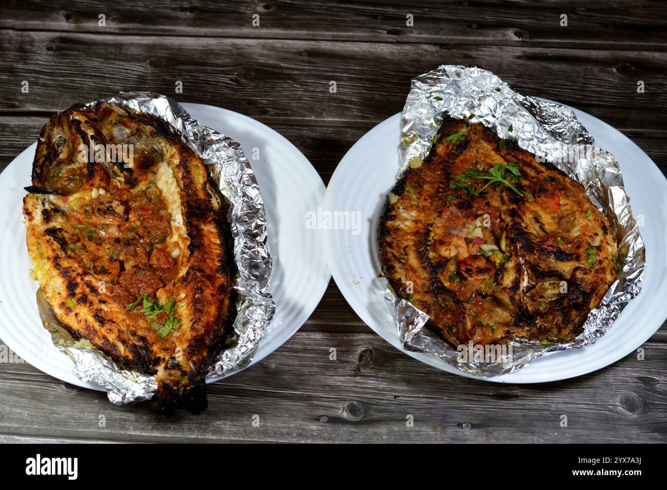 Steamed tilapia fish herbs in hi-res stock photography and images - Alamy