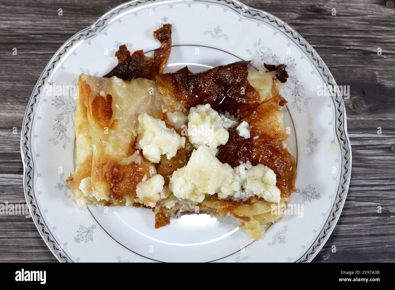 Creamy qeshta or fresh milk cream on a a cushioned pie or Feteer ...