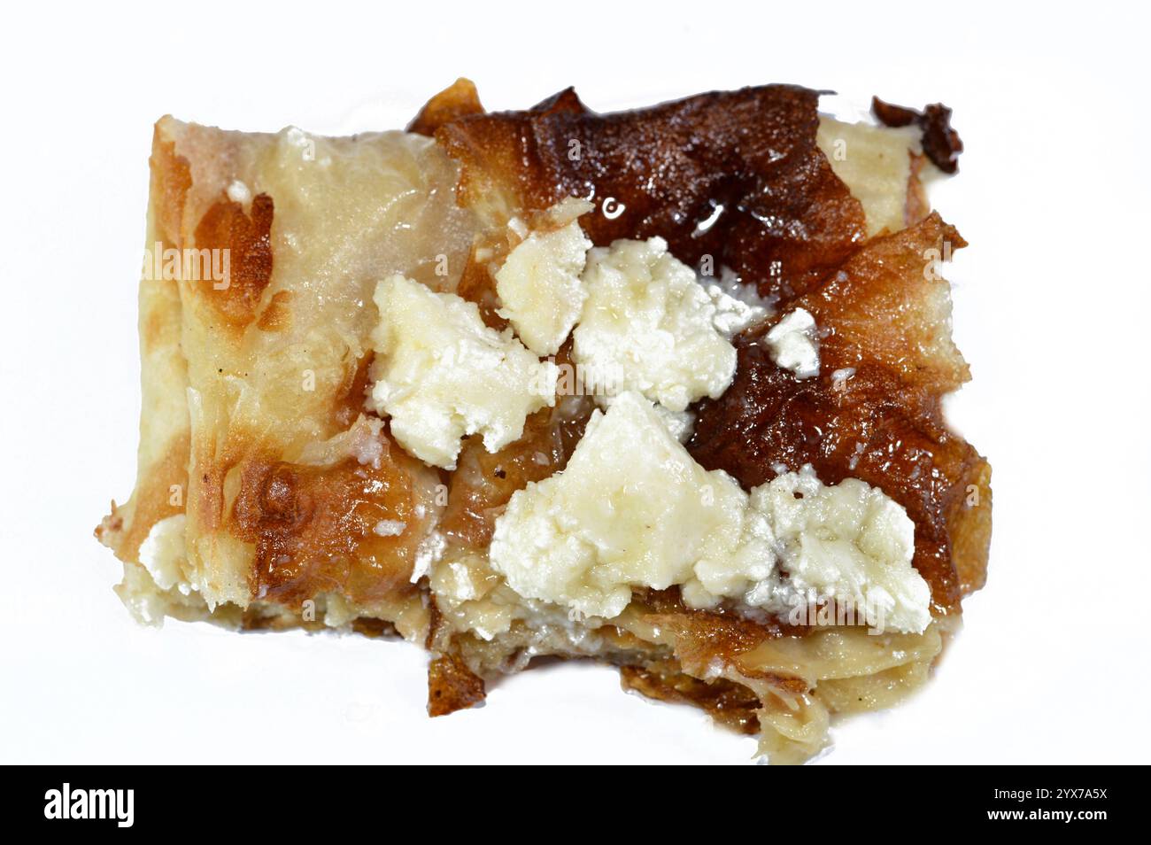 Creamy qeshta or fresh milk cream on a a cushioned pie or Feteer ...