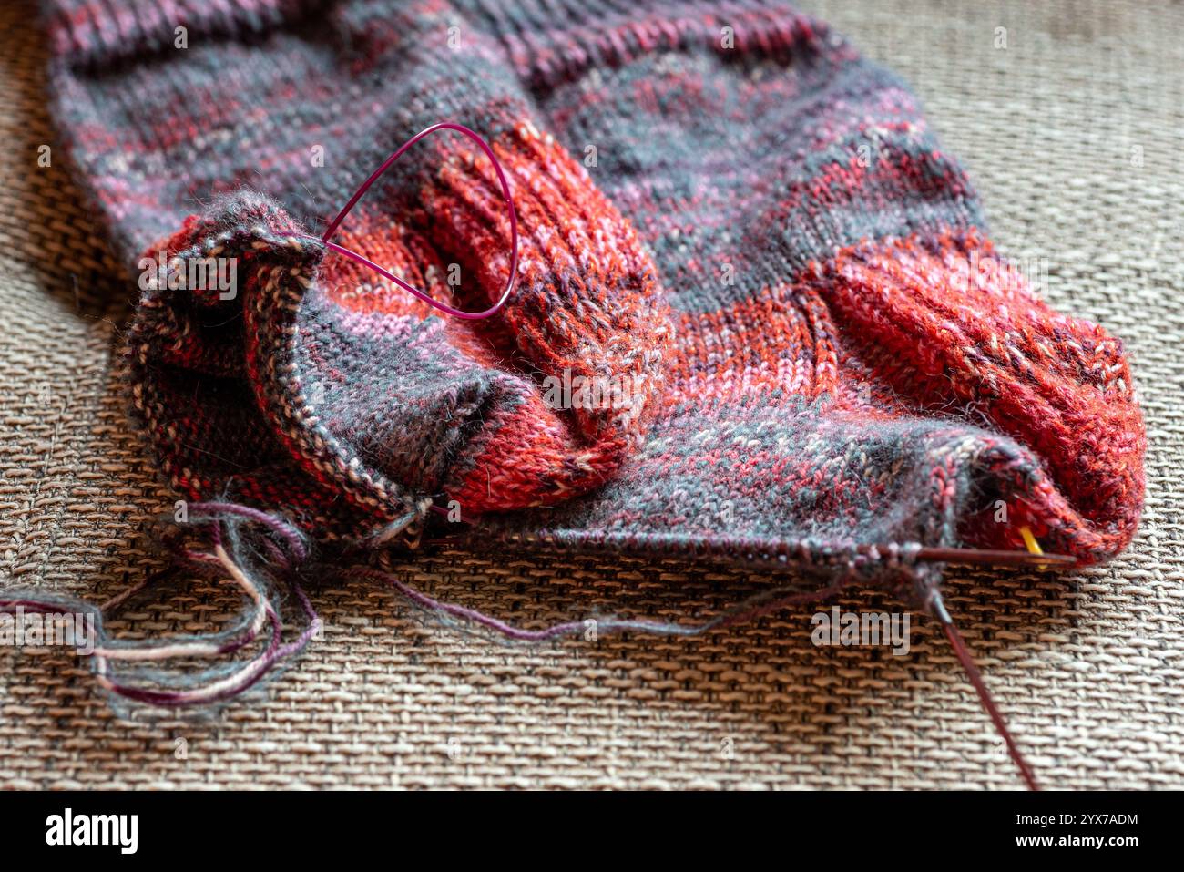 colorful knitted work in progress, handicraft concept, knit texture ...