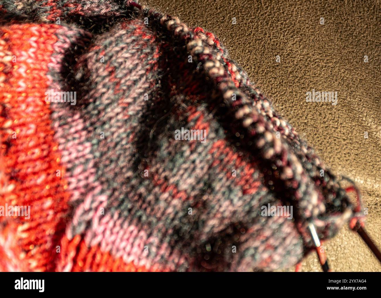 colorful knitted work in progress, handicraft concept, knit texture ...