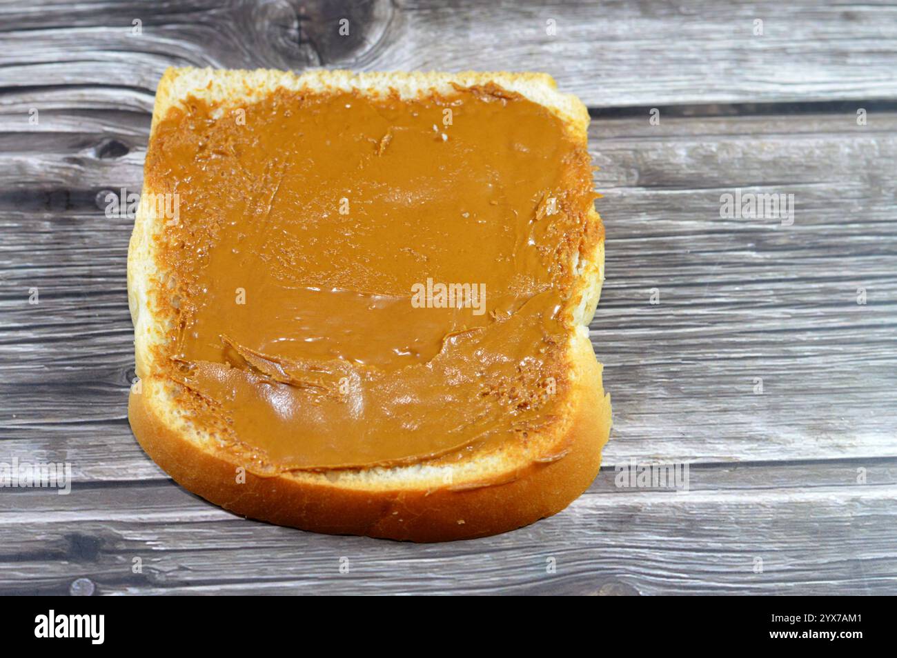 A normal toast bread with biscuits butter spread, caramelized biscuit ...