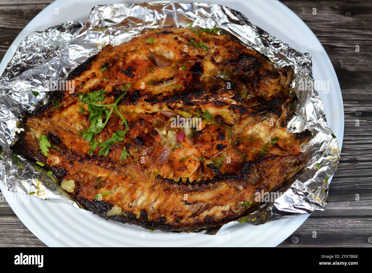Steamed tilapia fish herbs in hi-res stock photography and images - Alamy