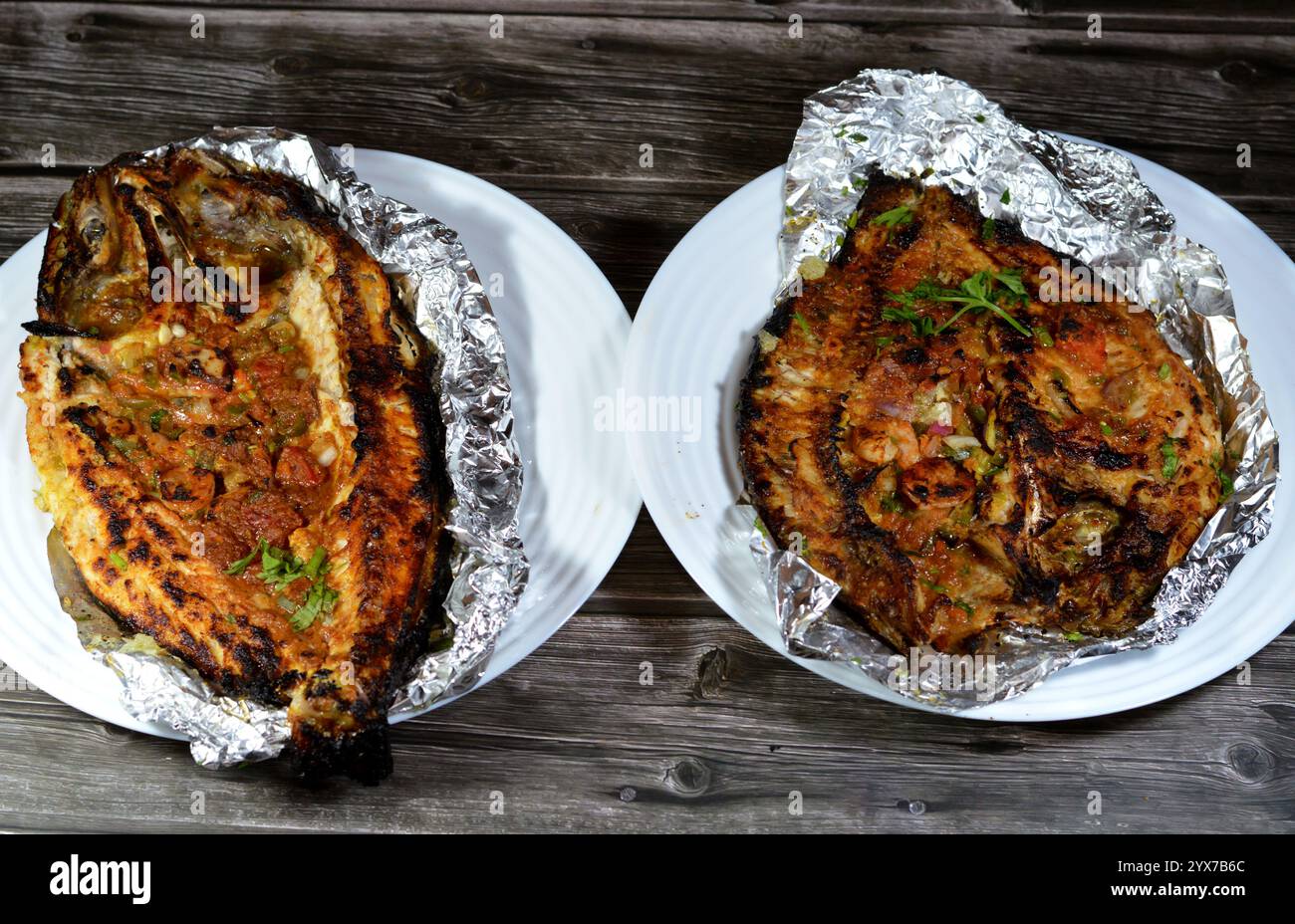 Tilapia, Mullet Sinjari Fishes, the fish is opened and grilled with oil ...