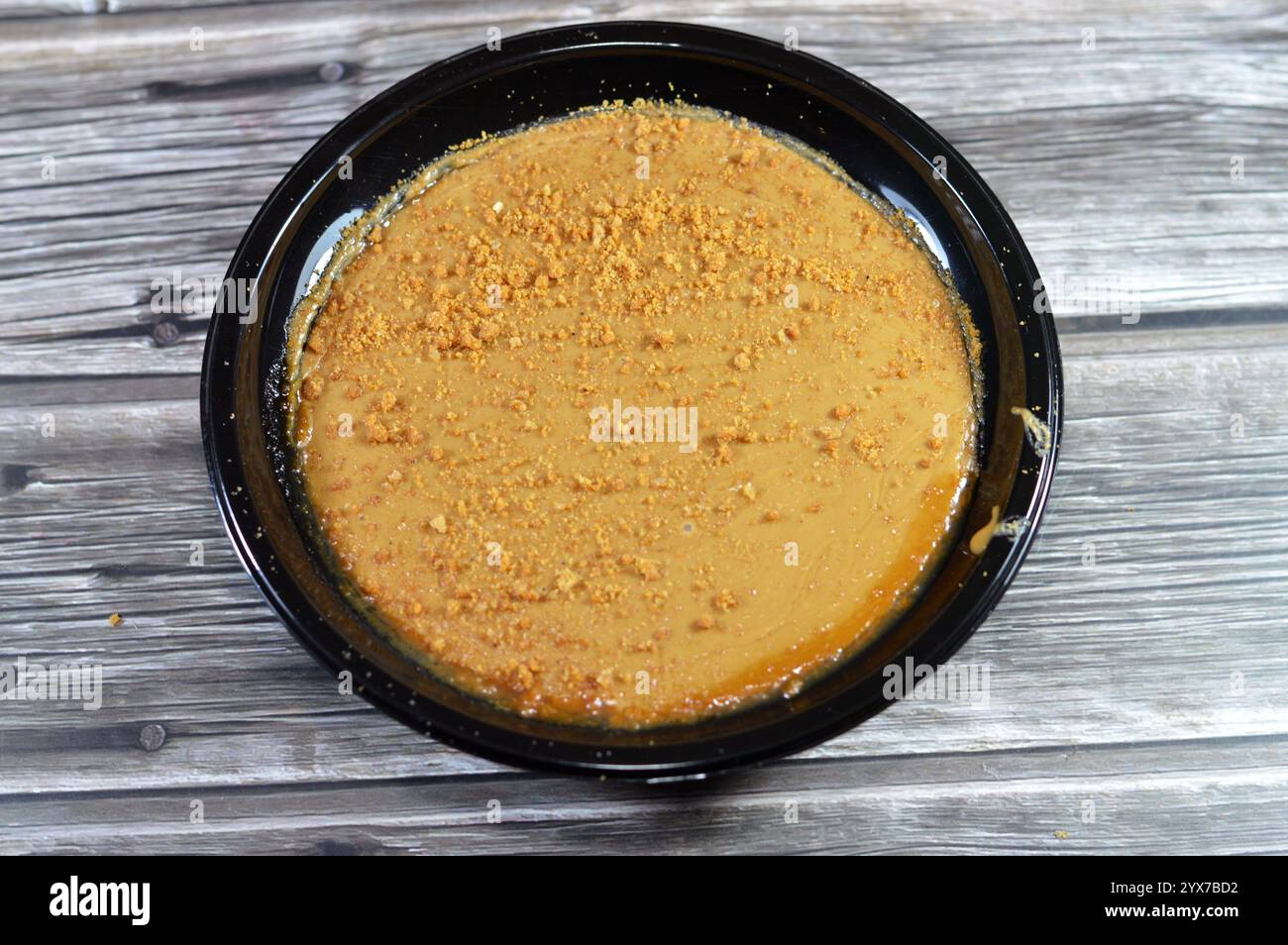 Rice pudding topped with Biscuits butter spread and pieces, also called ...