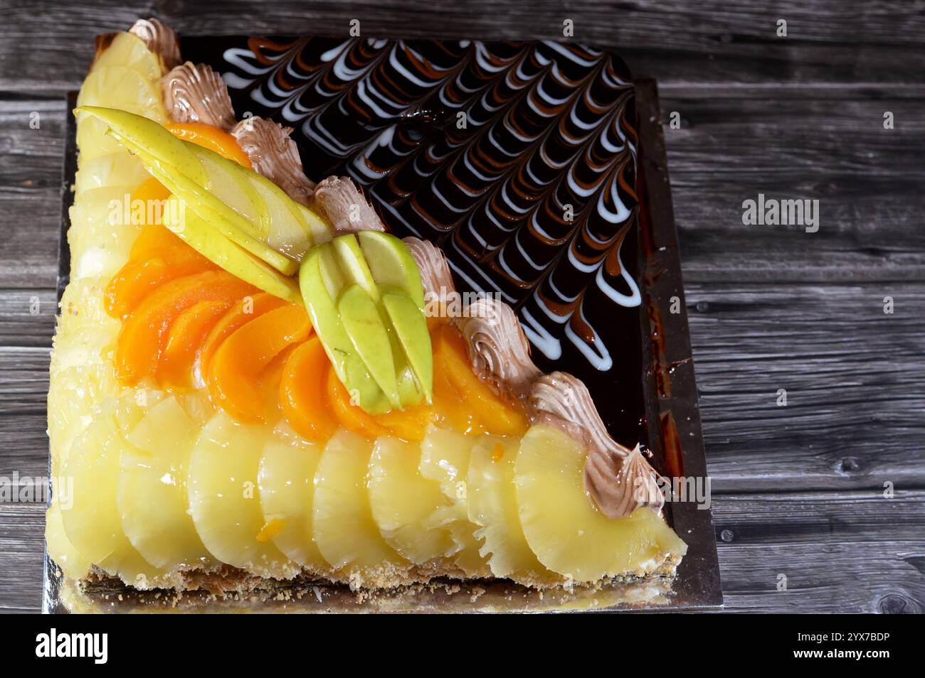 A square shape birthday cake of two halves different pieces sponge ...