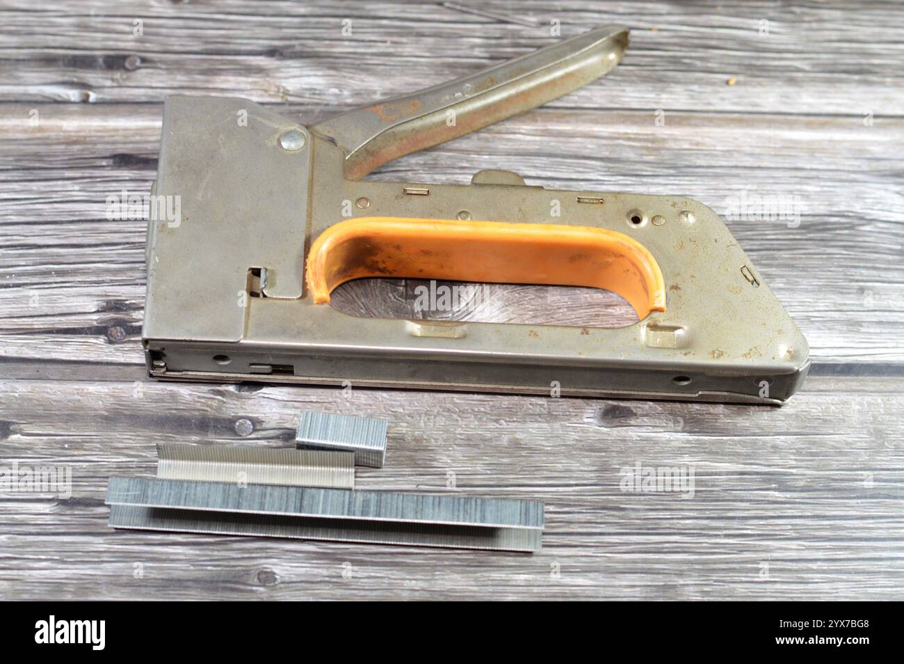 manual staple gun, powered stapler is a hand-held machine used to drive ...