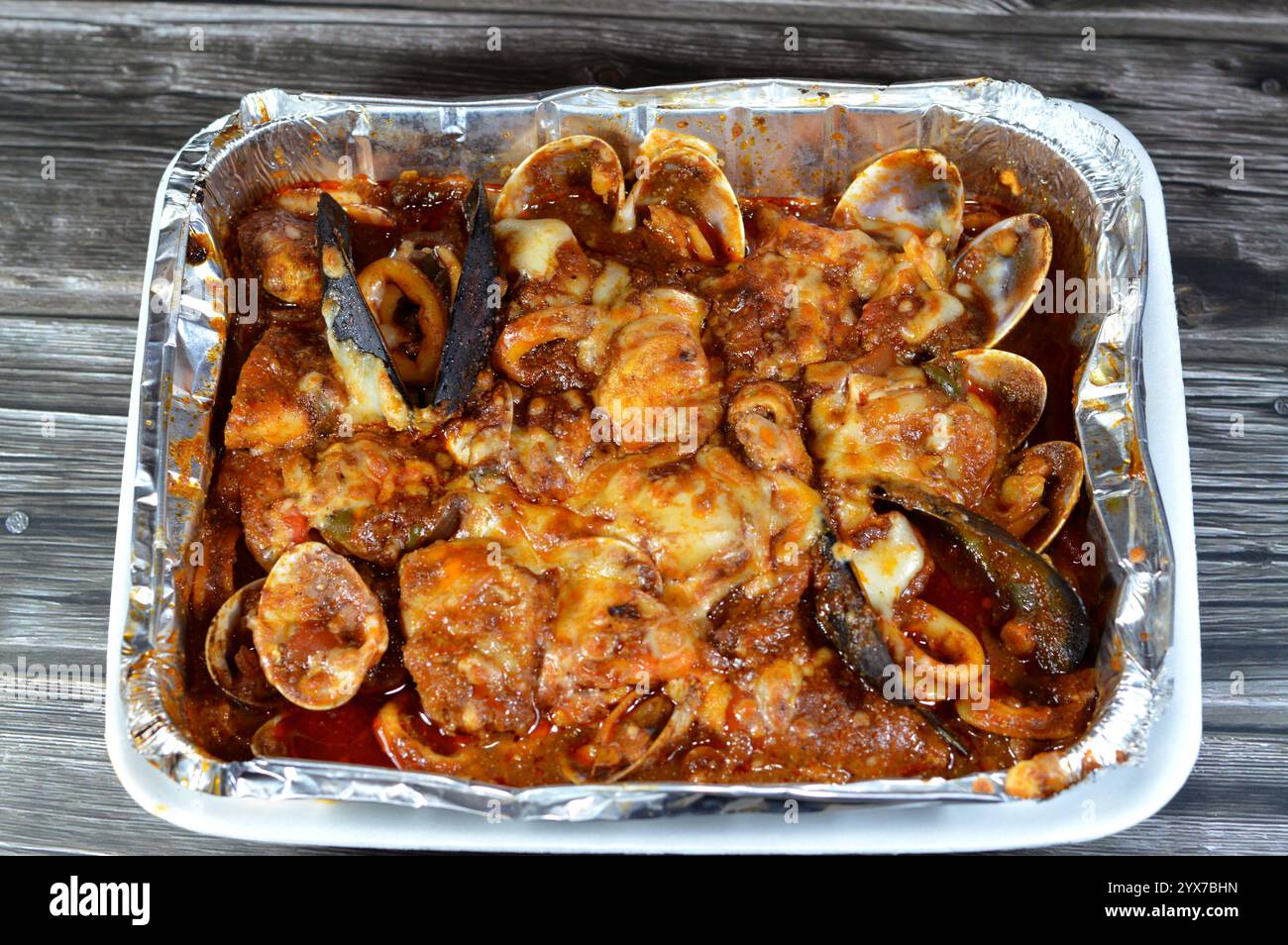 Baked assorted seafood cuisine mixed hi-res stock photography and ...