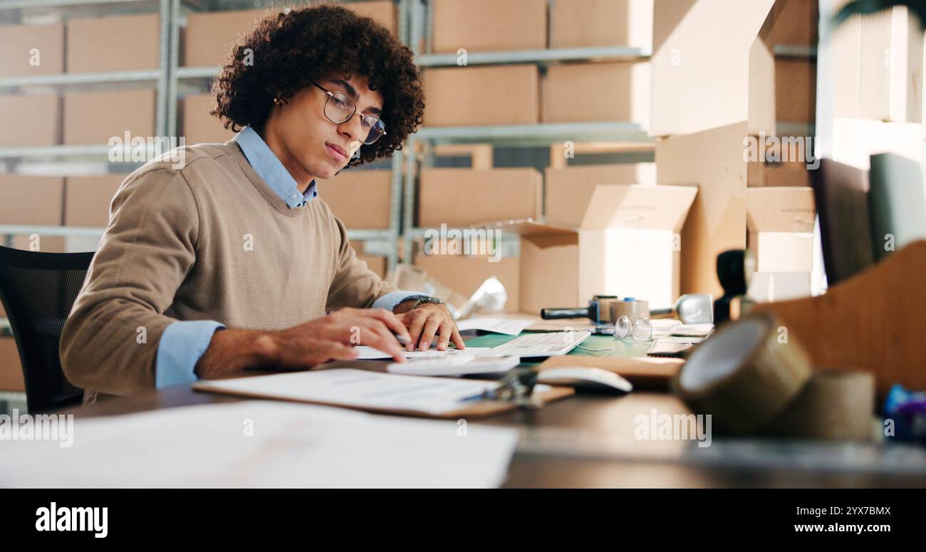 Man, writing and paperwork for distribution in warehouse, inventory ...