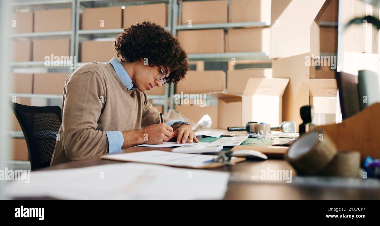 Man, writing and documents for distribution in warehouse, inventory ...