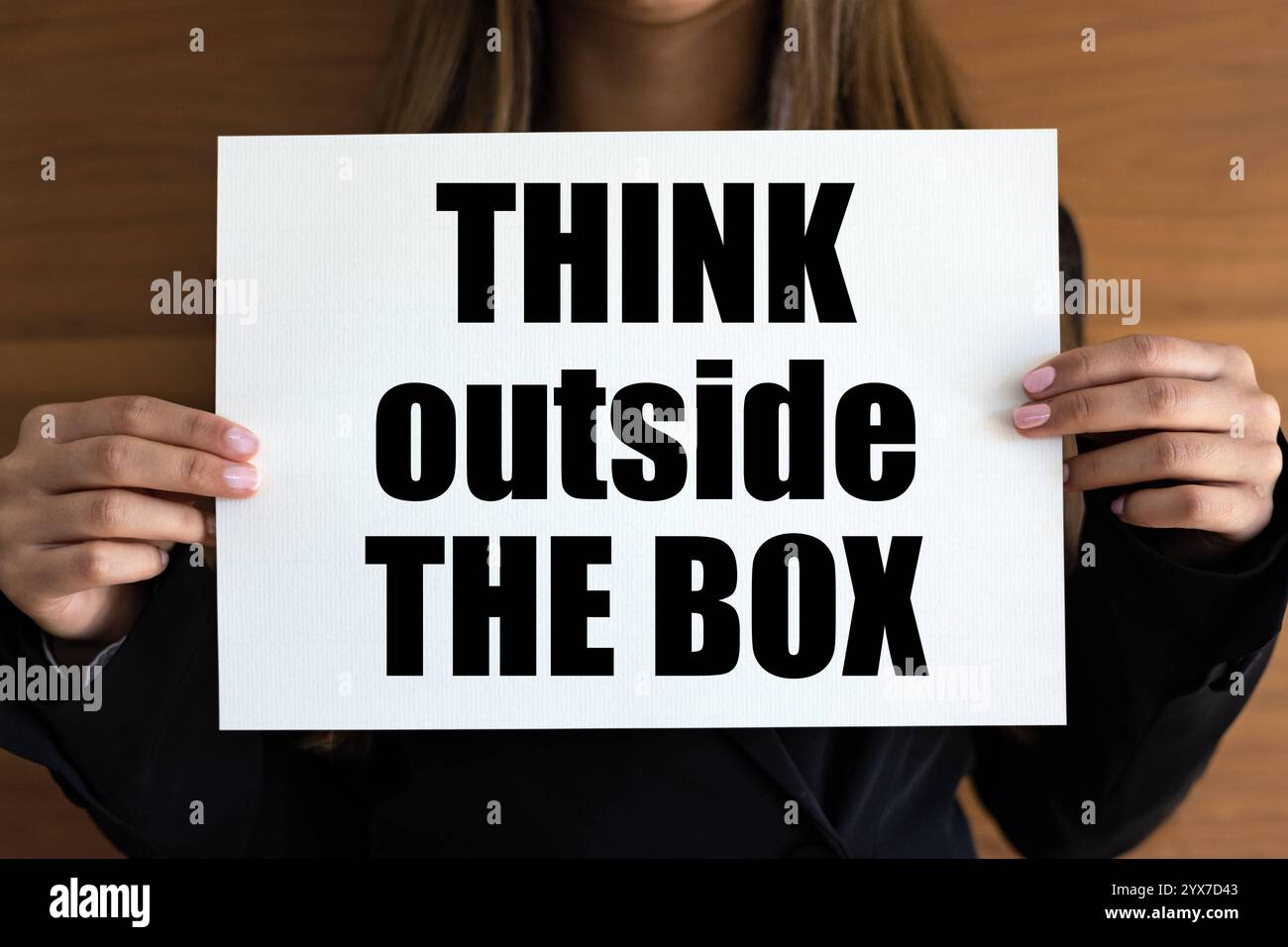 Think outside the box. Think outside the box. Woman with white page ...